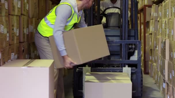 Warehouse worker packing boxes Stock Video Footage by ©Wavebreakmedia ...