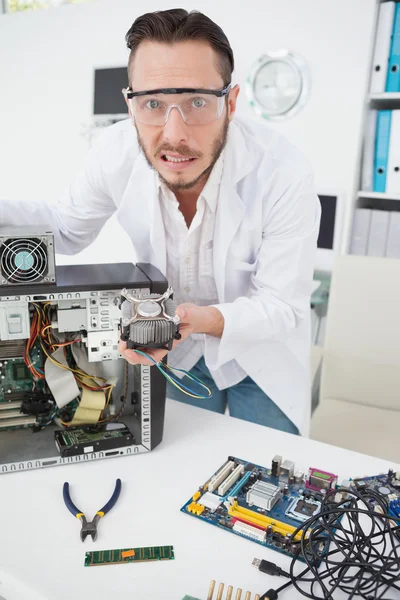 Computer engineer working on cpu part in front of open cpu Stock Photo ...