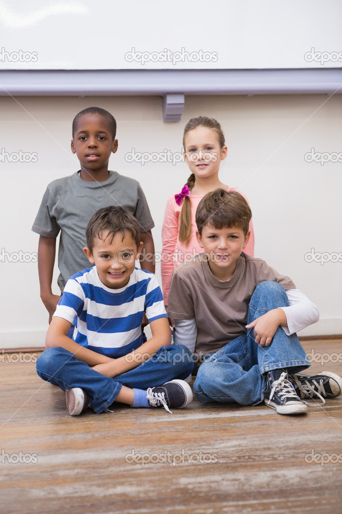 Classmates smiling together in classroom — Stock Photo © Wavebreakmedia ...