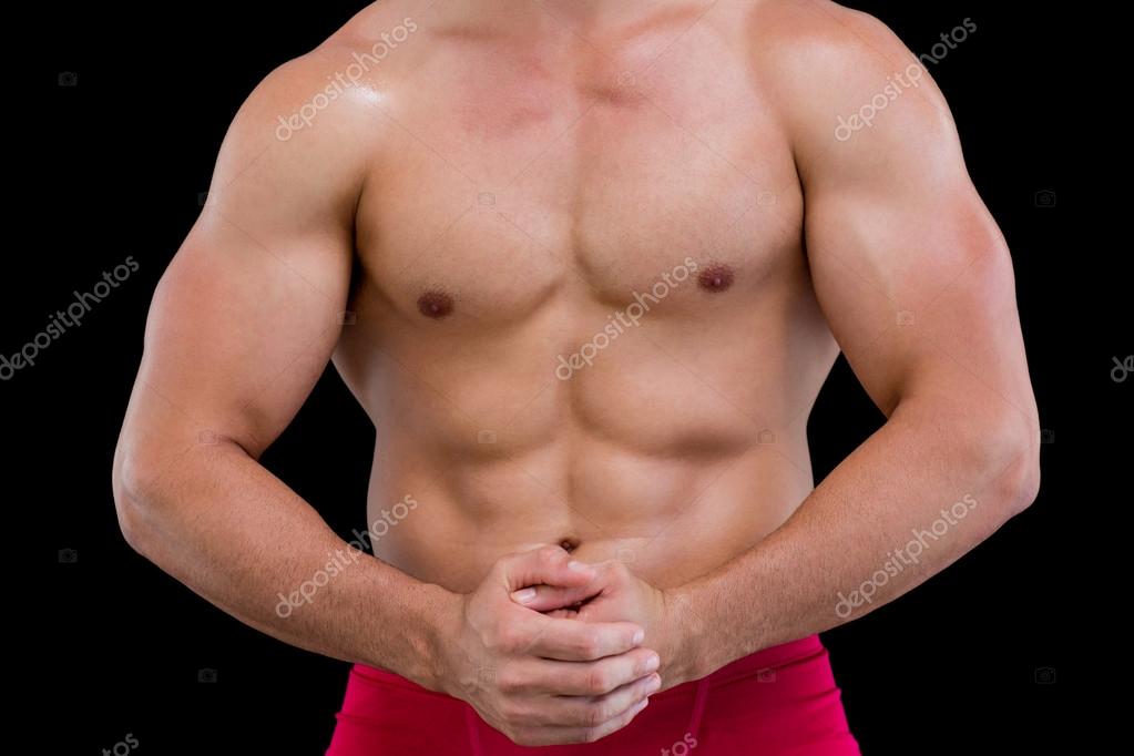 Mid section of a shirtless muscular man Stock Photo by ©Wavebreakmedia ...