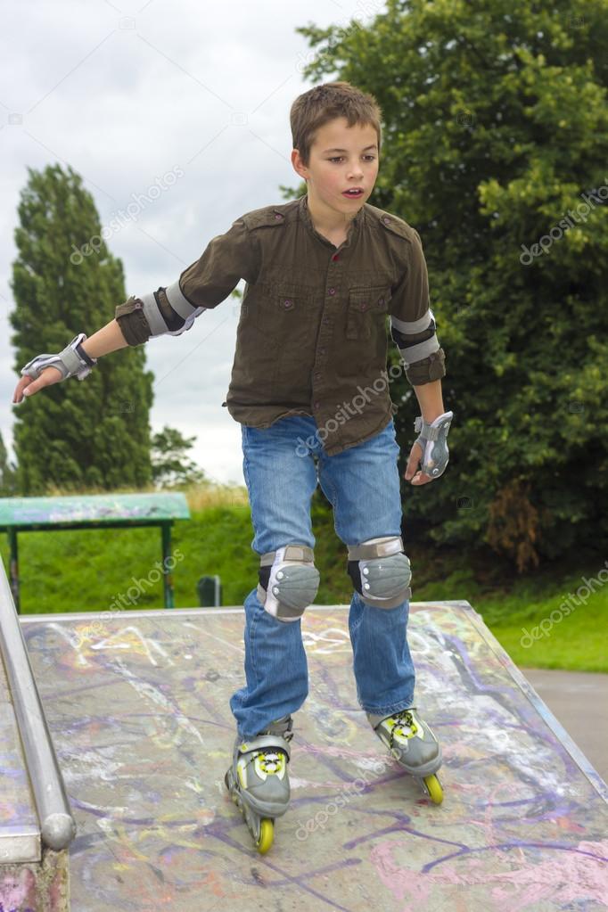 Shot of concentrated sliding rollerskaters in protection kit Stock ...
