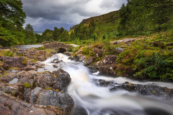 Ashness Bridge over the mountain stream in The Lake District National ...