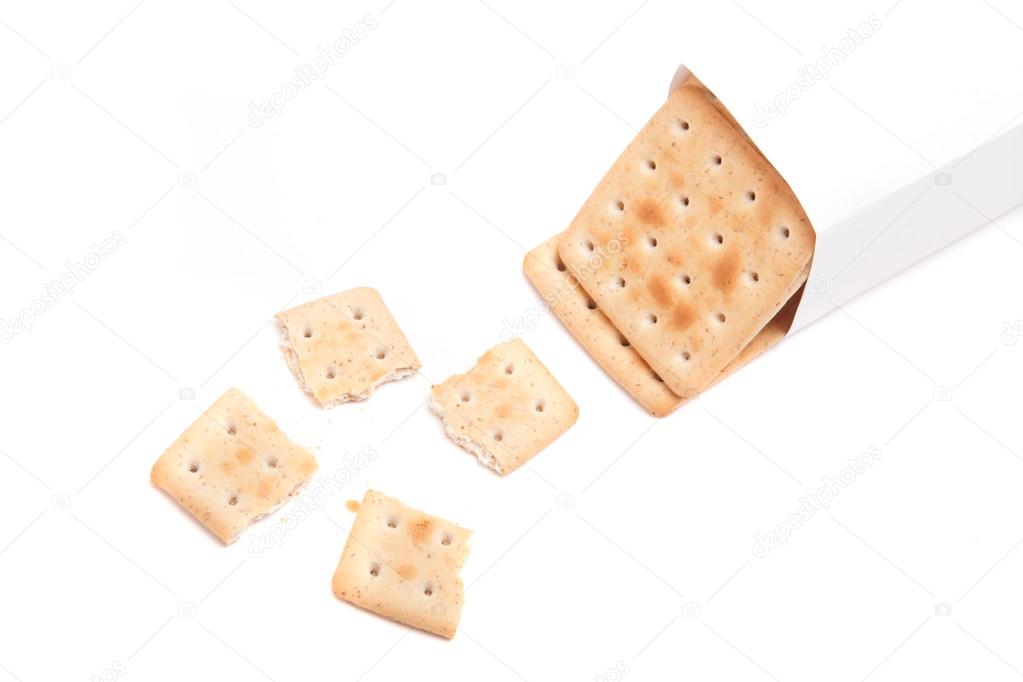 A packet of biscuits and one broken isolated on white background Stock ...