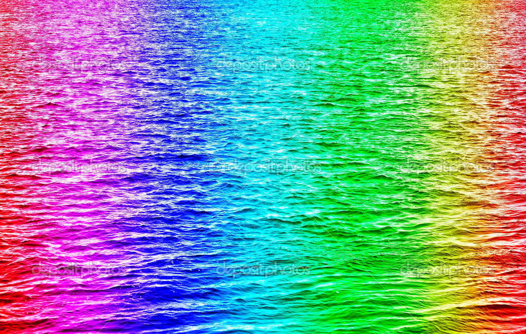 Rainbow colored water waves in ocean — Stock Photo © igorkovalcuk #22574133