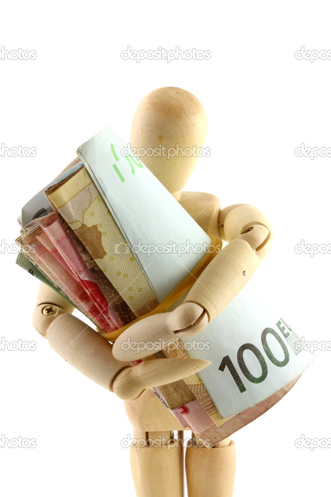 A wooden doll holding a roll of money Stock Photo by ©sasimoto 28557873