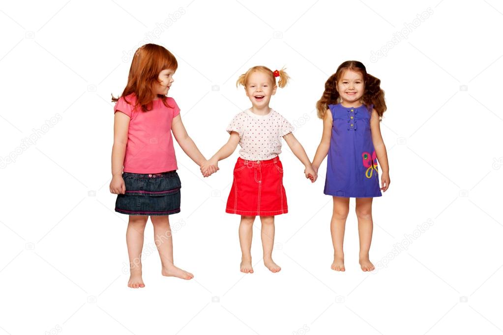 Three lovely smiling little girls holding hands Stock Photo by ...