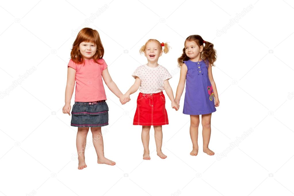 Three smiling little girls holding hands Stock Photo by ©Vitalinka 16335275