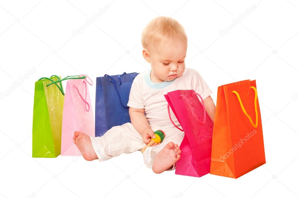 Baby shopping. Happy kid with shopping bags. Stock Photo by ©Vitalinka ...