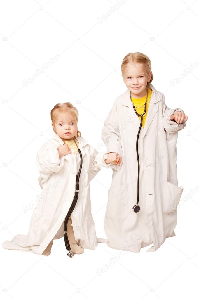 Two sisters playing as doctors. Stock Photo by ©Vitalinka 21370459
