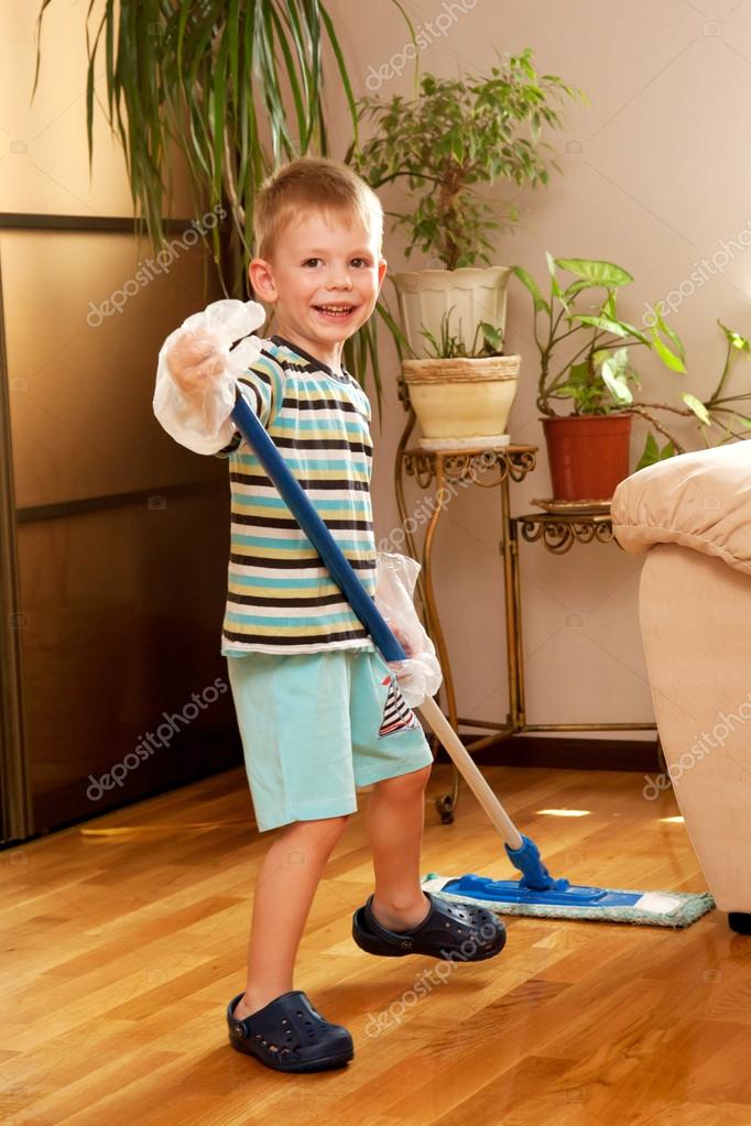 Little boy cleaning the room. — Stock Photo © Vitalinka #27286085