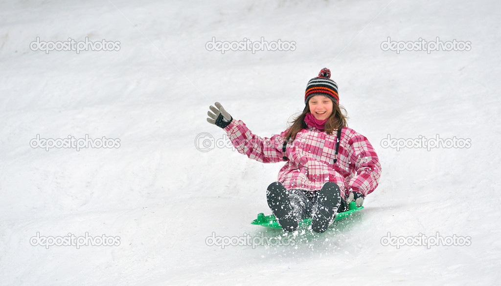 Girl sliding on sled Stock Photo by ©mady70 38335011