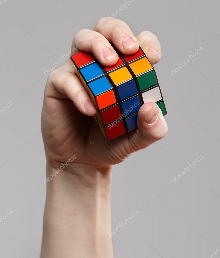 Man holding rubik cube in his hands – Stock Editorial Photo © kadrby ...