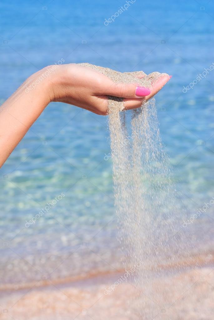 Sand pour away through the hands Stock Photo by ©EM_prize 24546493