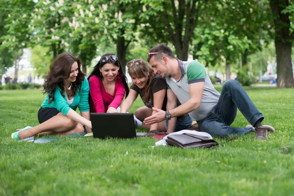 Group of young student using laptop together - Stock Image - Everypixel