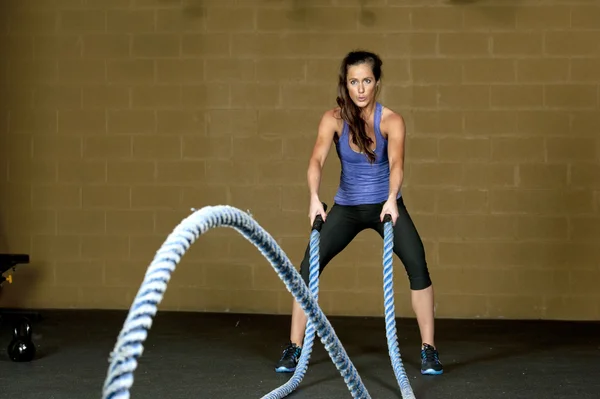 Woman training with atheltic training ropes - Stock Image - Everypixel