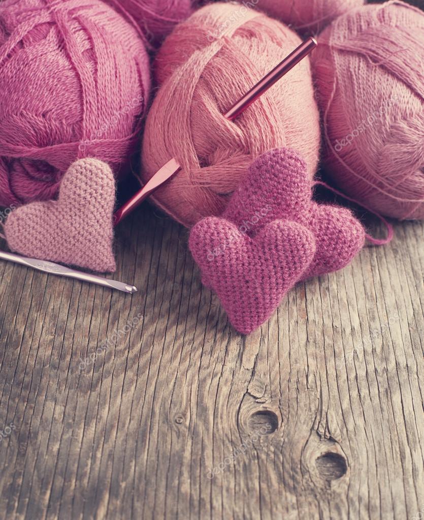 Crochet pink hearts and yarn on wooden background. — Stock Photo ...