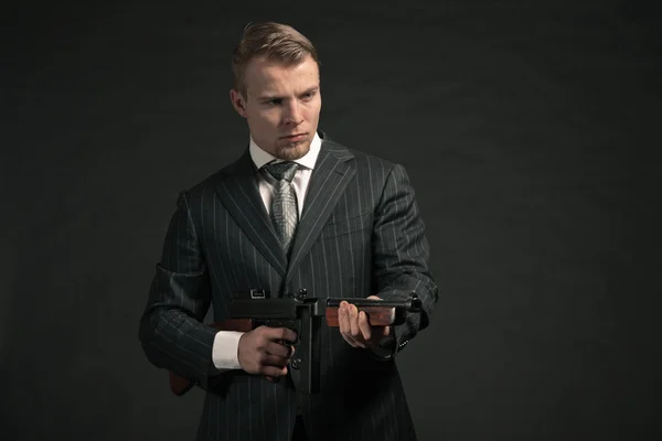 Mafia man with gun. Stock Photo by ©ysbrand 18593479