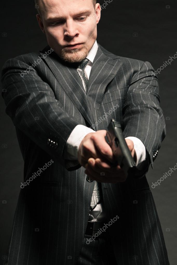 Mafia man with gun. Stock Photo by ©ysbrand 18593305