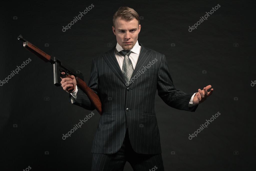 Mafia man with gun. Stock Photo by ©ysbrand 18593479