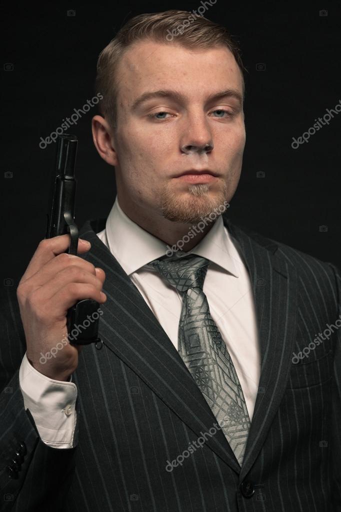 Mafia man with gun. — Stock Photo © ysbrand #18593691