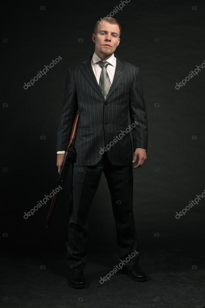 Mafia man with gun. Stock Photo by ©ysbrand 18593793