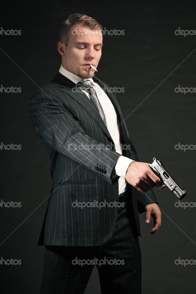Mafia man with gun. Stock Photo by ©ysbrand 18593967