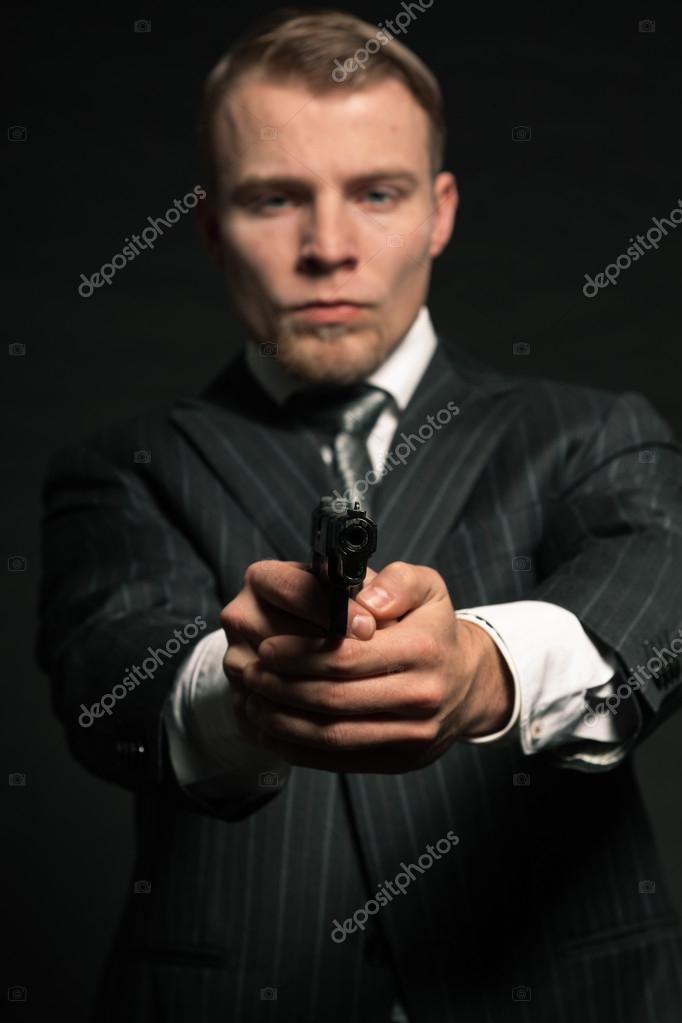 Mafia man with gun. — Stock Photo © ysbrand #18594067