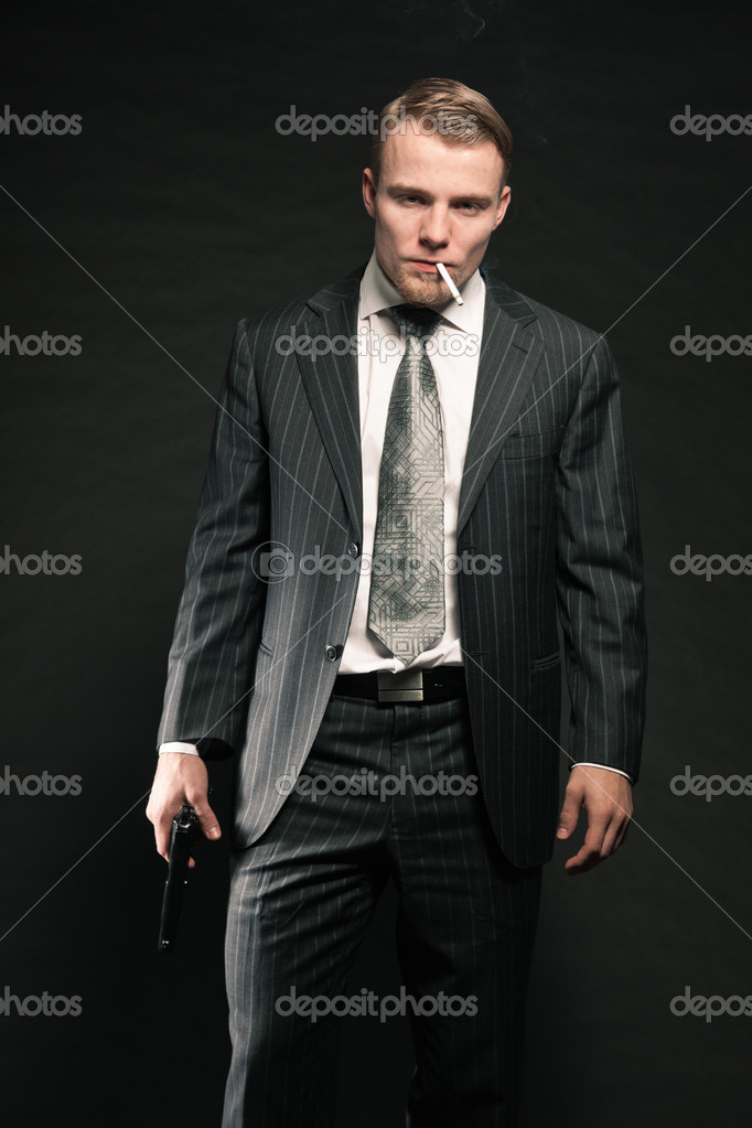 Mafia man with gun. Stock Photo by ©ysbrand 18594083