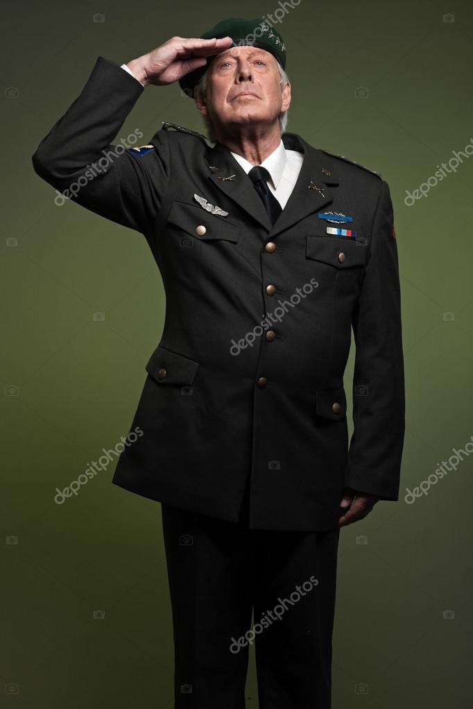 US military general wearing beret. Salutation. Studio portrait. Stock ...