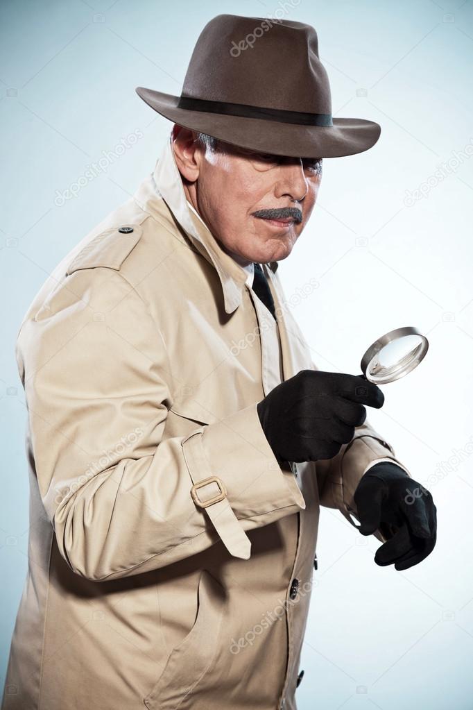 Retro detective man with mustache and hat. Holding magnifying gl ...