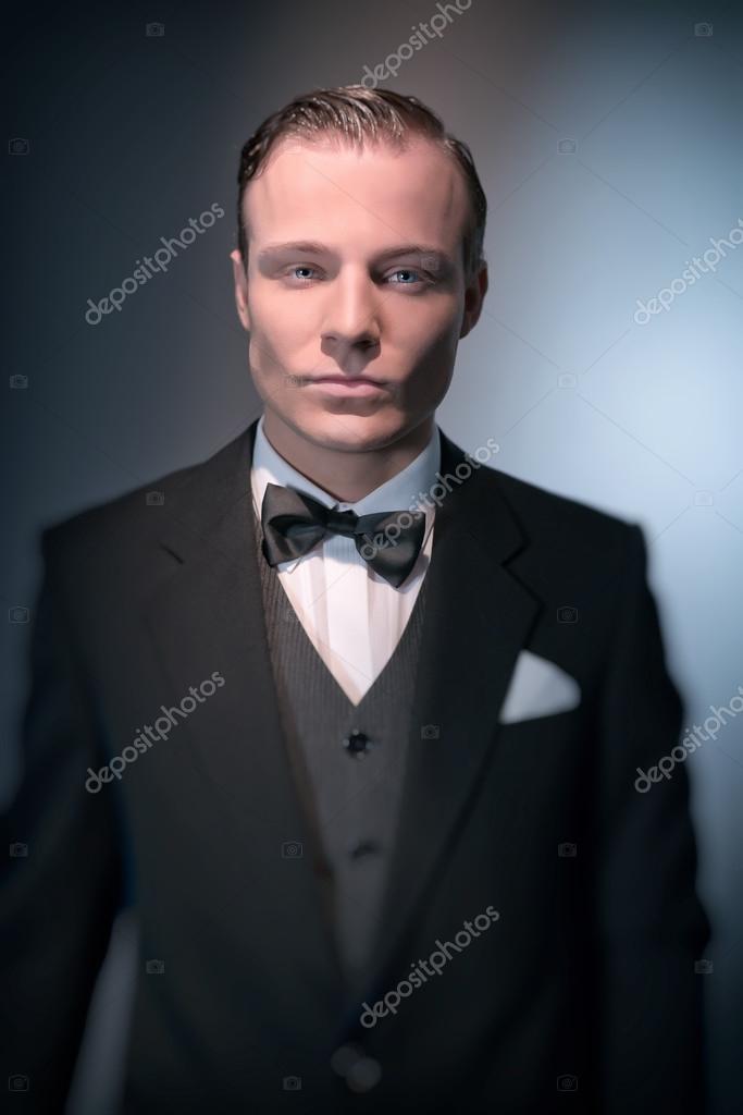 Retro 1920 business fashion man wearing black suit and bow tie. Stock ...