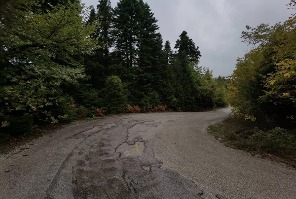 Pothole road Stock Photos, Royalty Free Pothole road Images | Depositphotos