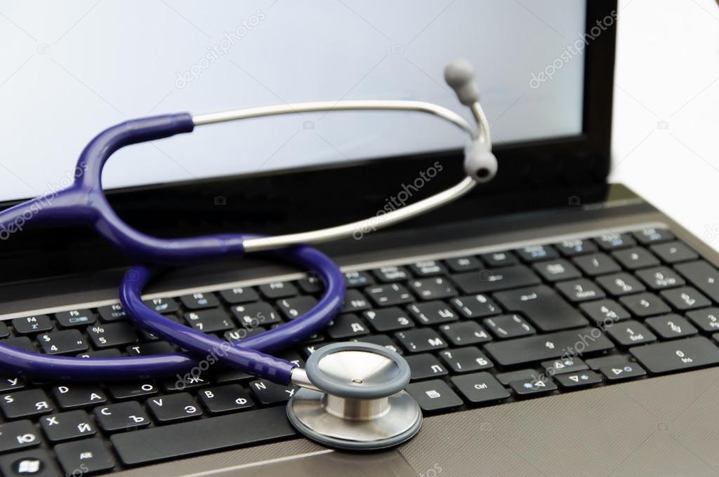 Stethoscope on laptop Stock Photo by ©kimmik 38312303