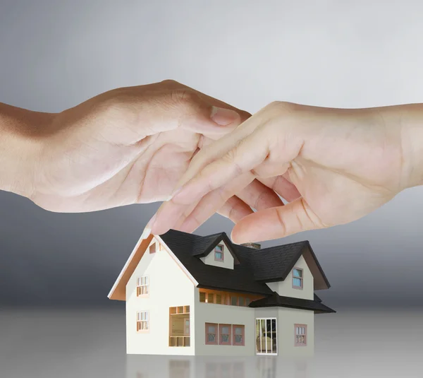 House in human hands Stock Photo by ©violetkaipa 11012916