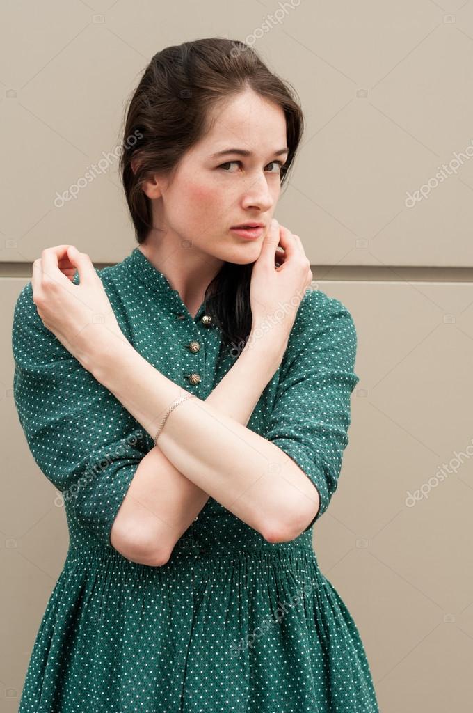 Young female model having her arms crossed on her ches — Stock Photo ...