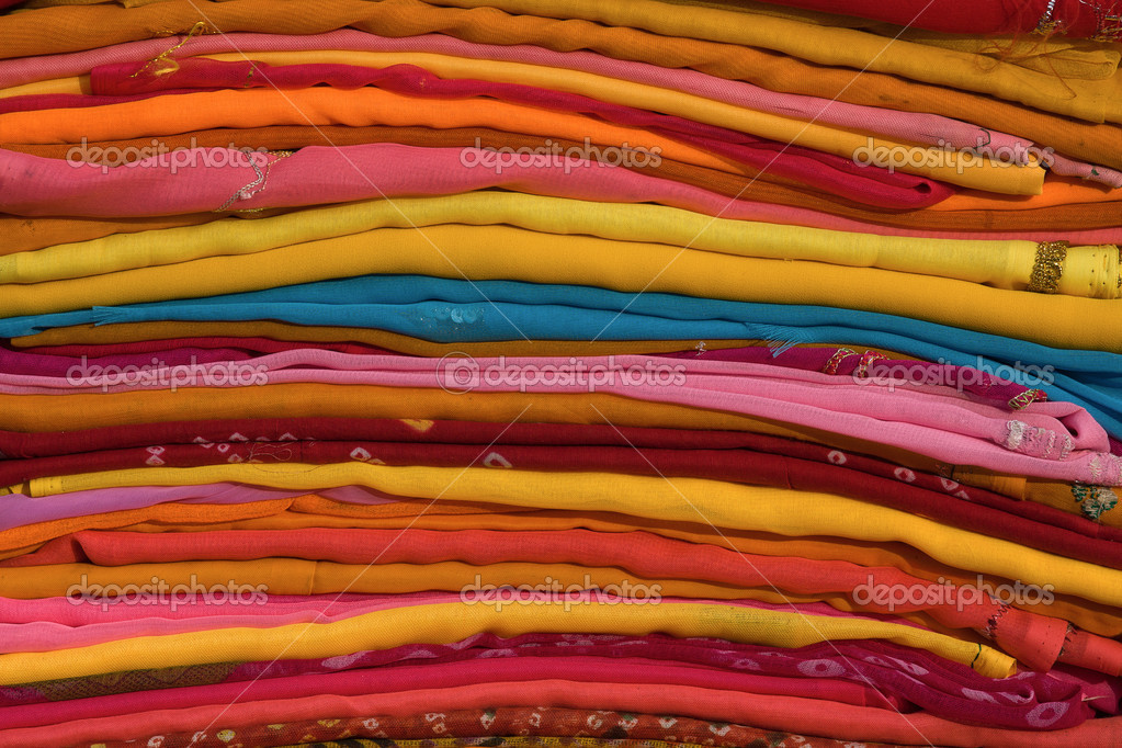 Heap of cloth fabrics at a local market in India Stock Photo by ...