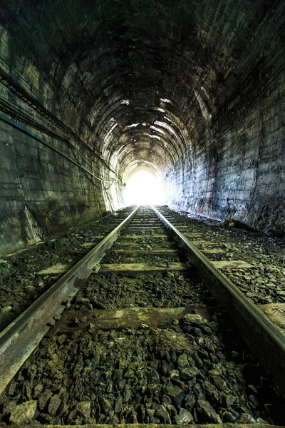 Light at the end of railroad tunnel - Stock Image - Everypixel
