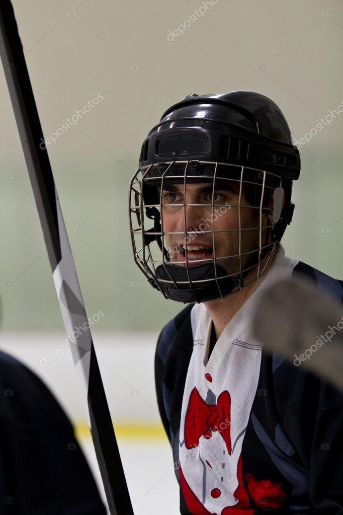 Hockey player watches the game from the bench — Stock Photo ...