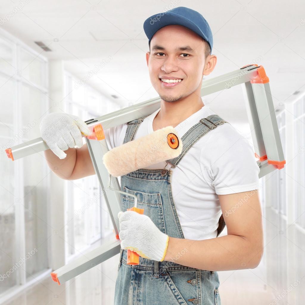 Happy painter worker Stock Photo by ©odua 19847575
