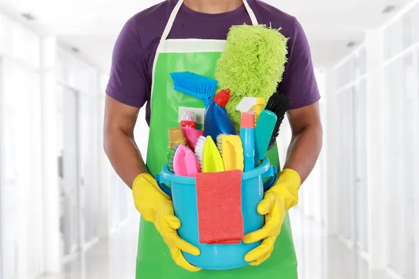 Portrait of man with cleaning equipment - Stock Image - Everypixel