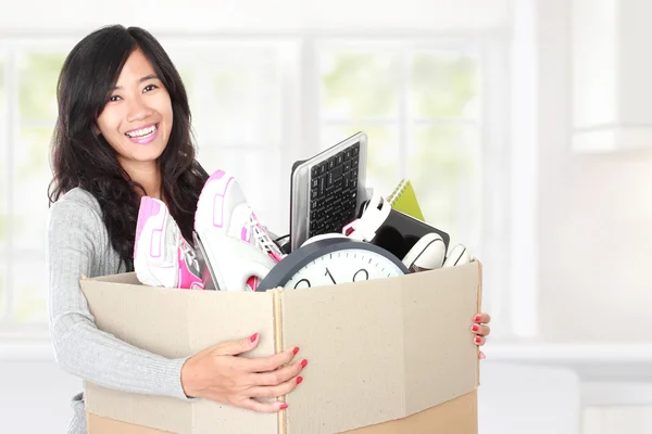 moving day. woman with her stuff inside the cardboard box - Stock Image ...