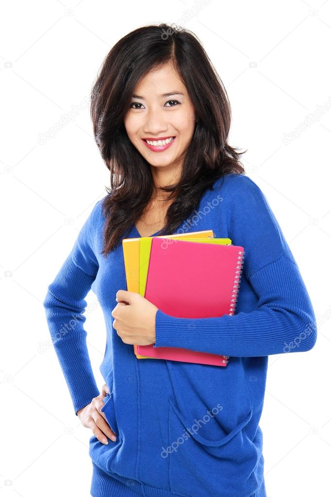 Beautiful female student holding notebooks — Stock Photo © odua #42983593