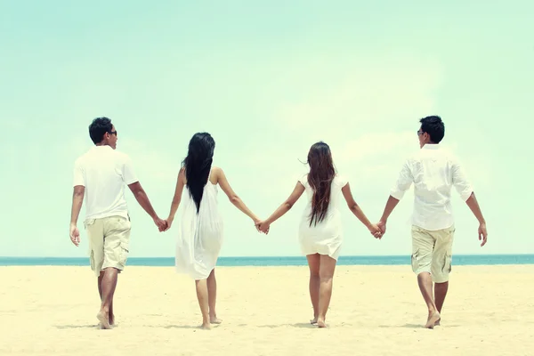 best friend in white walking together holding each other hand - Stock ...