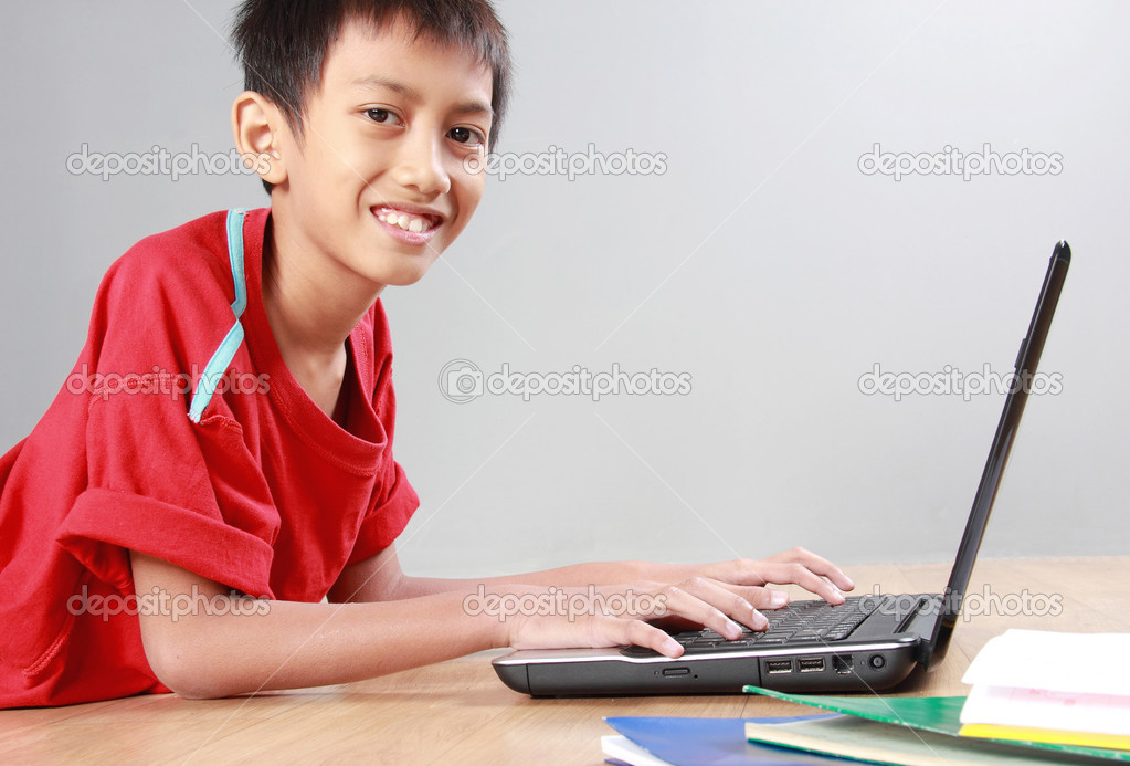 Kid using laptop Stock Photo by ©odua 50000263