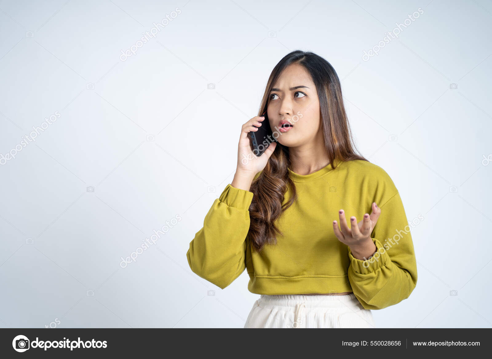 Sad young woman making a call using a smartphone Stock Photo by ©odua ...