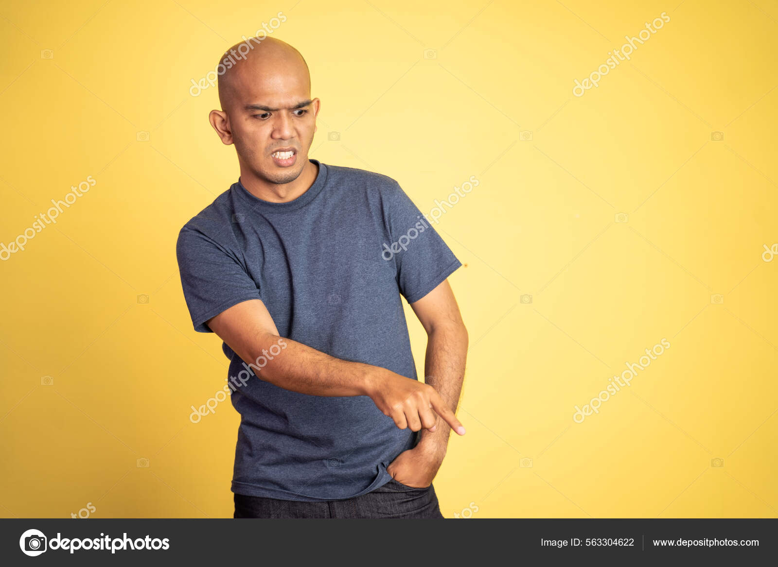 Angry asian bald man pointing down while standing — Stock Photo © odua ...