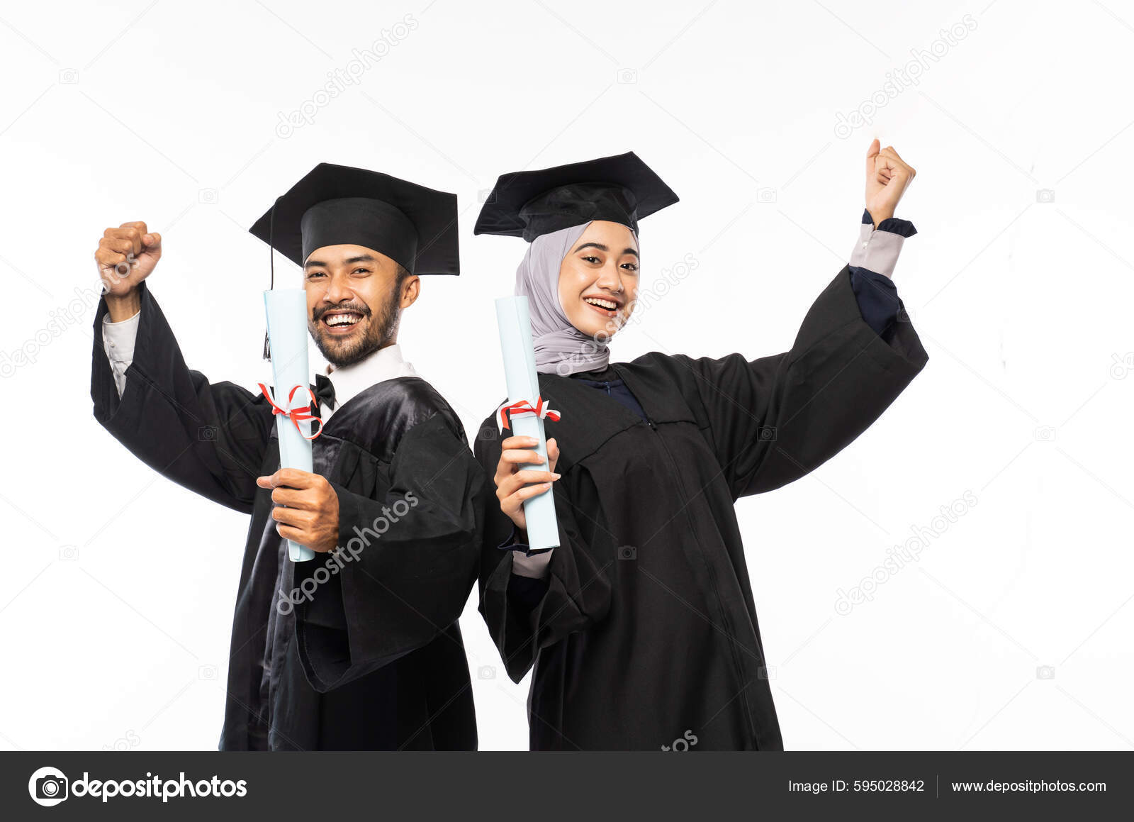 Two Confident Graduates Wearing Togas Holding Certificate While ...
