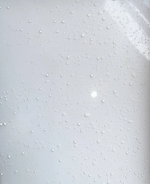 Water droplets on a white background. For background about drizzling ...