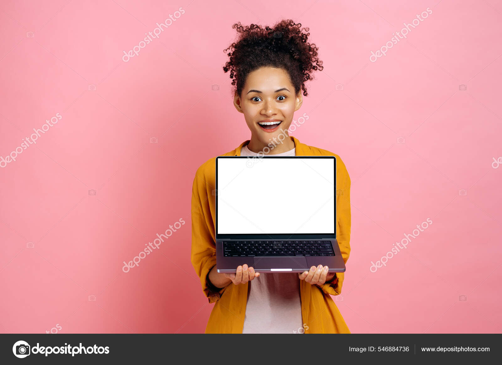 Excited dark skinned positive young woman in casual wear, holding open ...