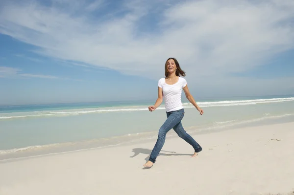 Pretty woman walking exercise beach Stock Photo by ©roboriginal 15964795